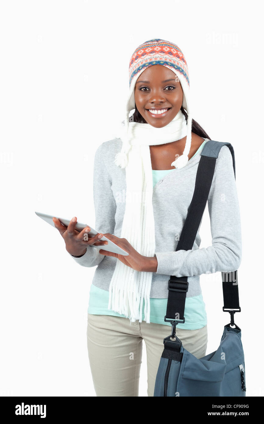 Smiling young student in winter clothes with her tablet Stock Photo - Alamy