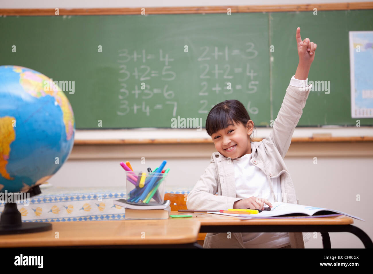 Smart student raising hand question hi-res stock photography and images ...