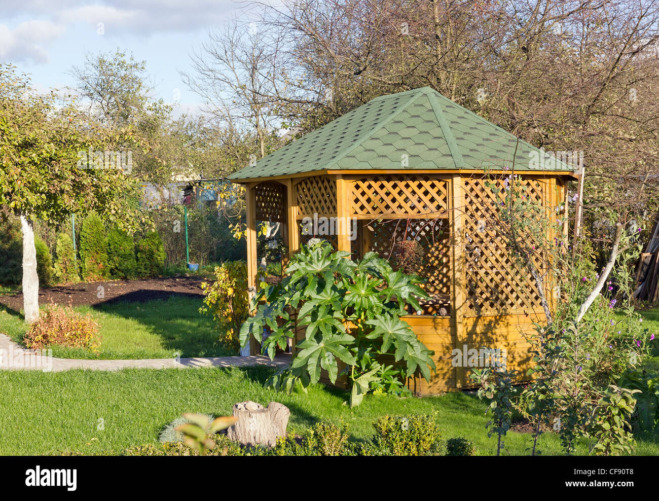Wooden summer pavilion for barbecue in the european garden Stock Photo ...