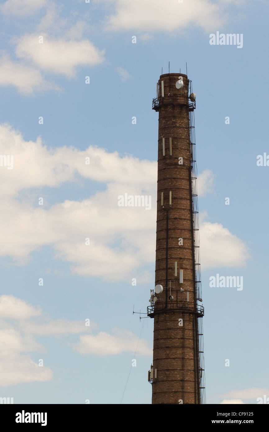 Global telecommunications equipment on pipe with blue sky on the ...