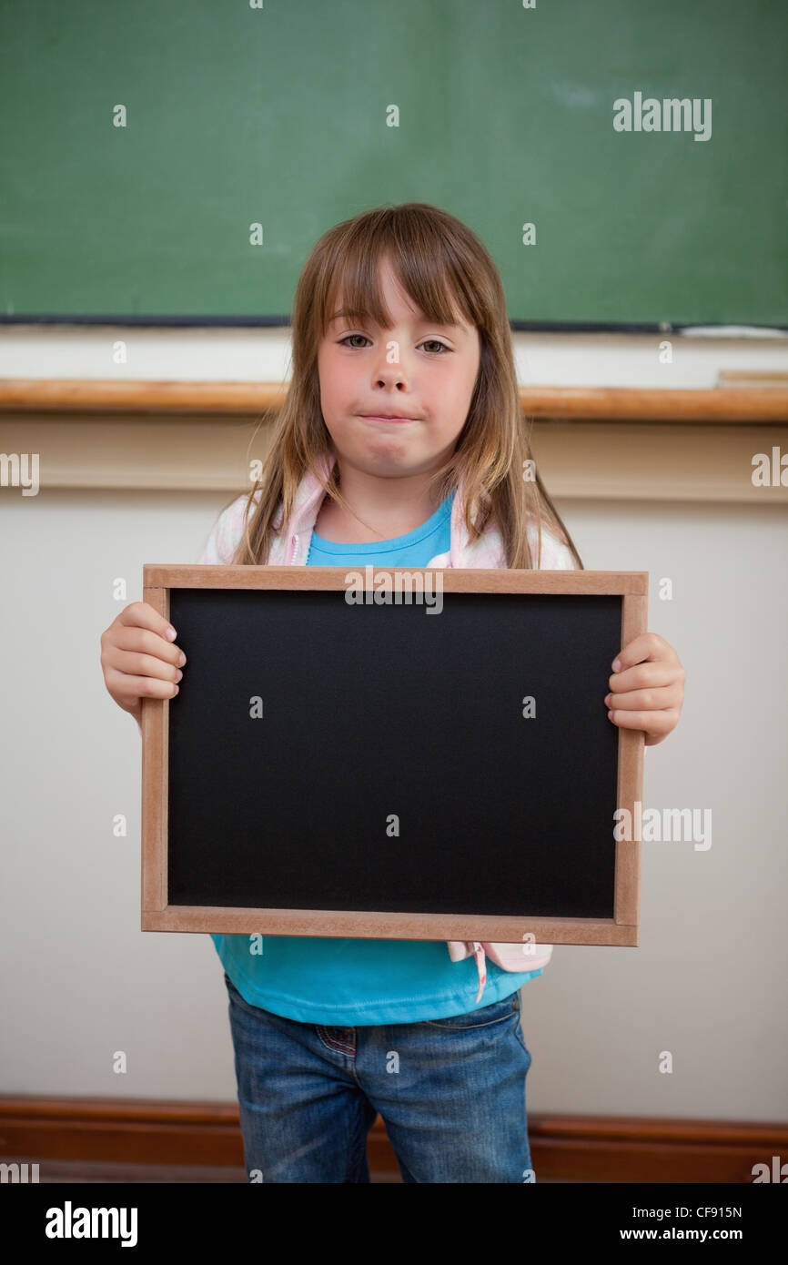 Portrait of a little girl holding a school slate Stock Photo - Alamy