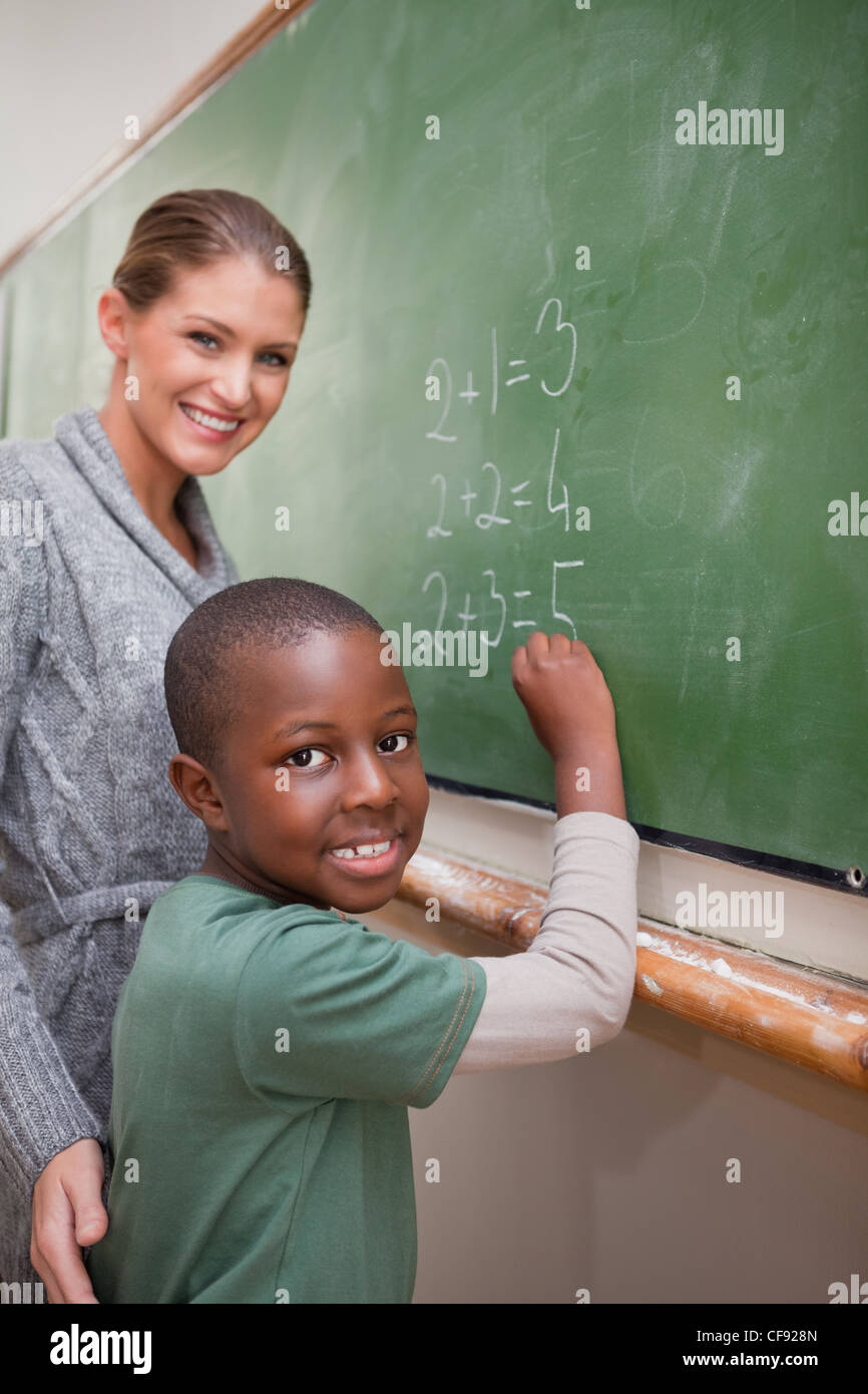 Portrait of a teacher explaining mathematics to a pupil Stock Photo - Alamy