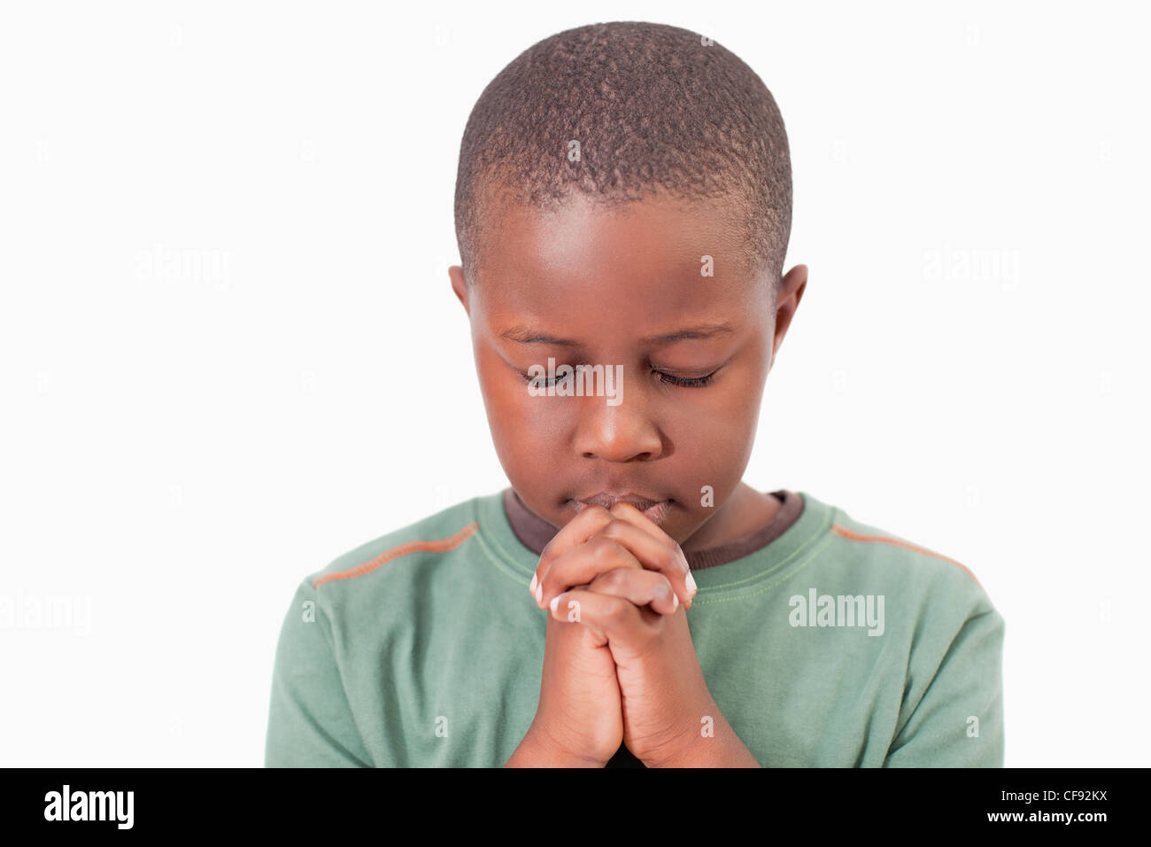 Young boy praying Stock Photo - Alamy