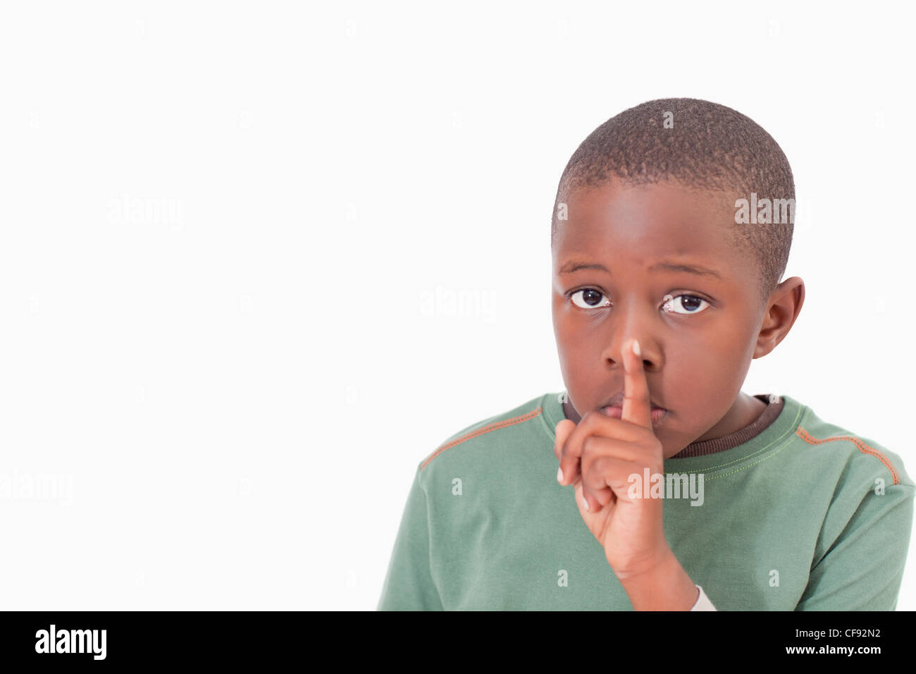 Boy asking for silence Stock Photo - Alamy