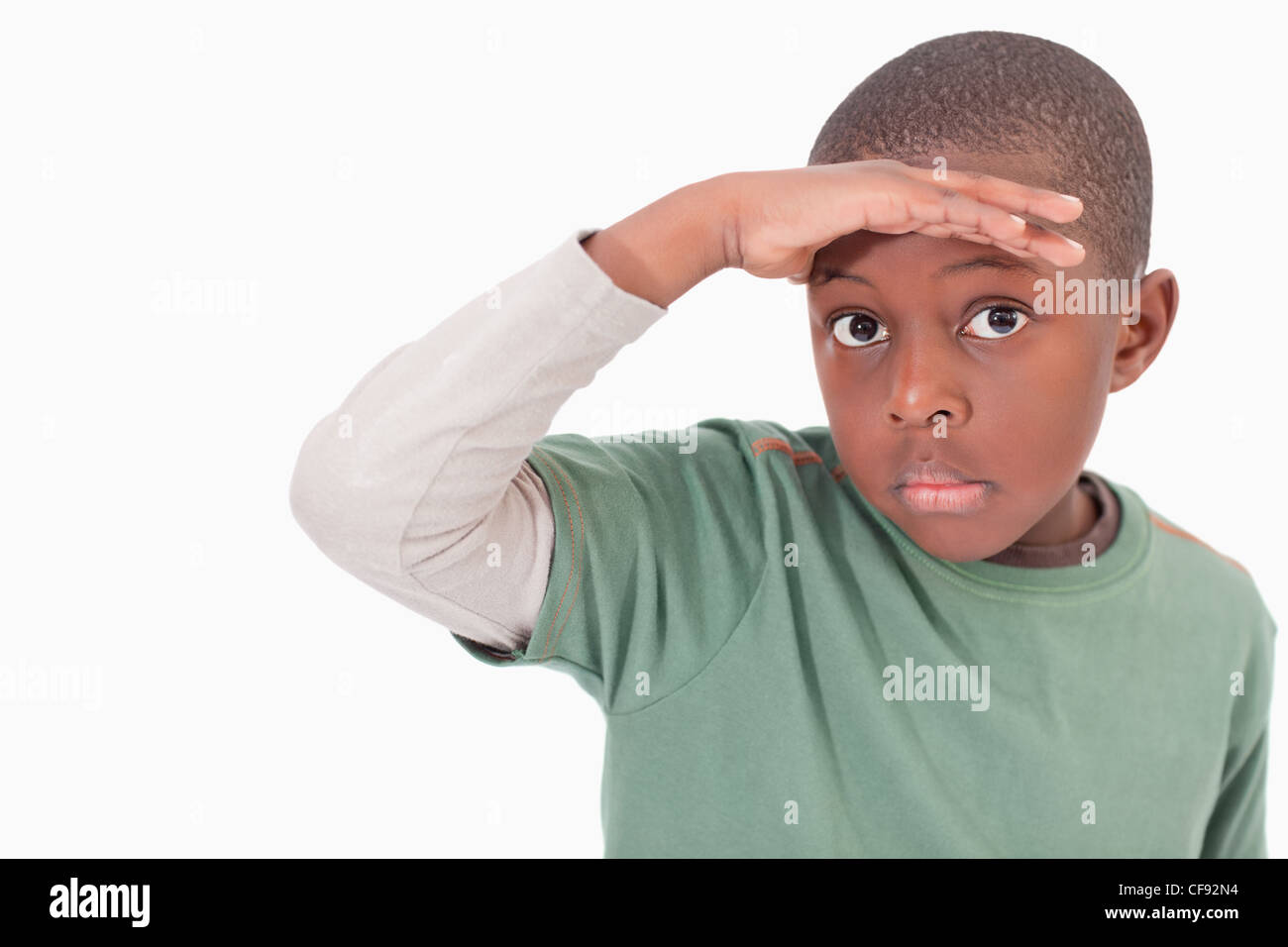 Boy putting his hand on his forehead Stock Photo - Alamy