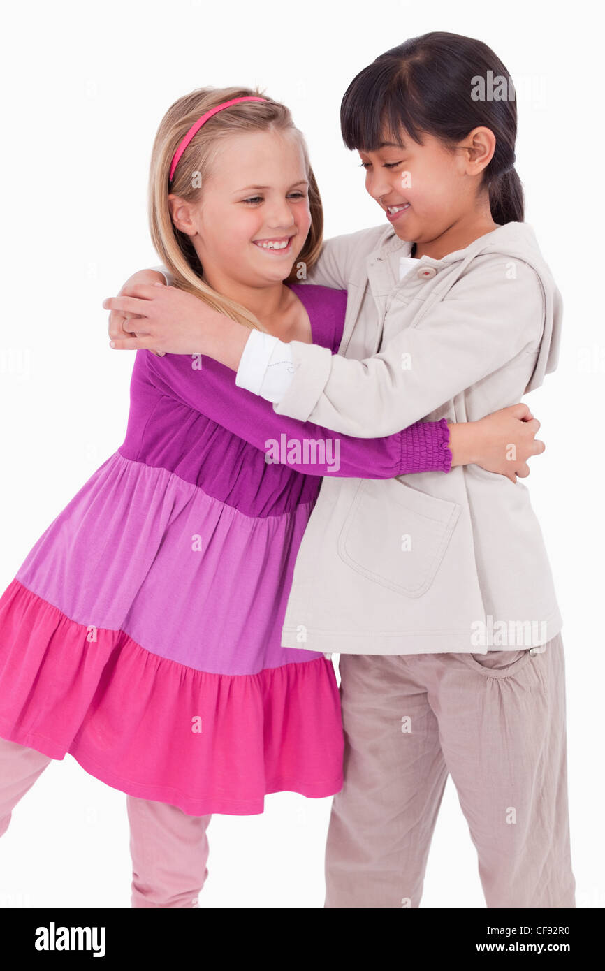 Portrait of girls hugging Stock Photo - Alamy