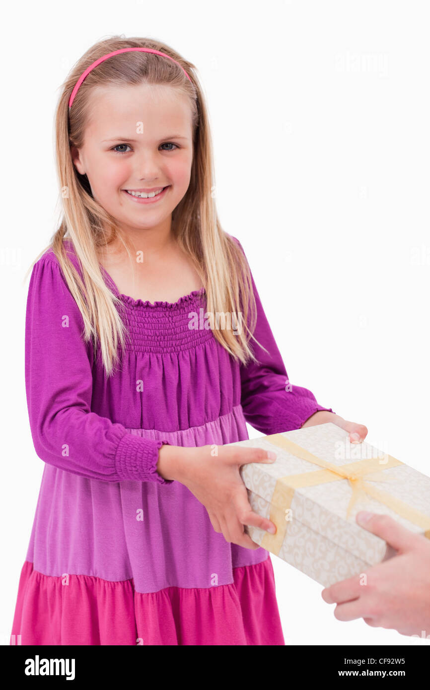Portrait of a happy girl receiving a present Stock Photo - Alamy