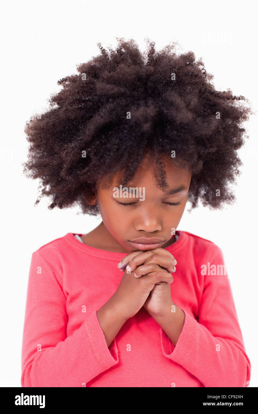 Portrait of a girl praying Stock Photo - Alamy