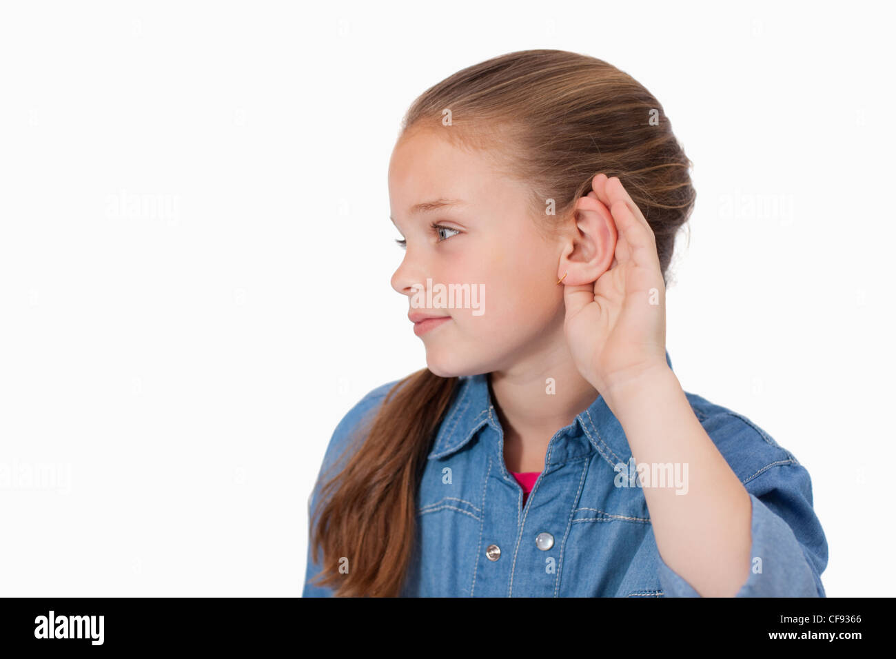Cute girl pricking up her ear Stock Photo - Alamy