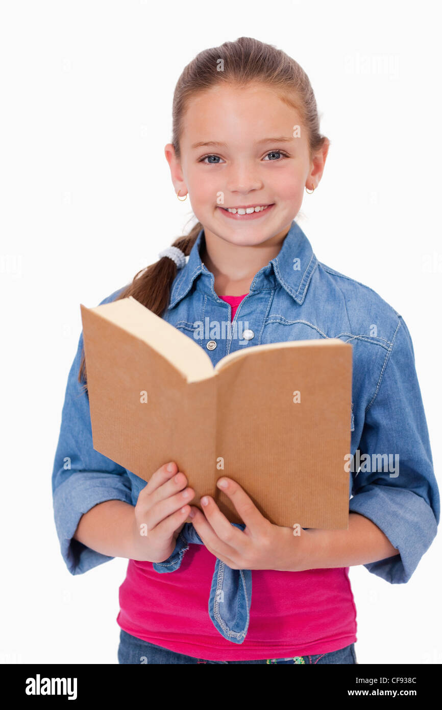 Portrait of a smart girl reading a book Stock Photo - Alamy
