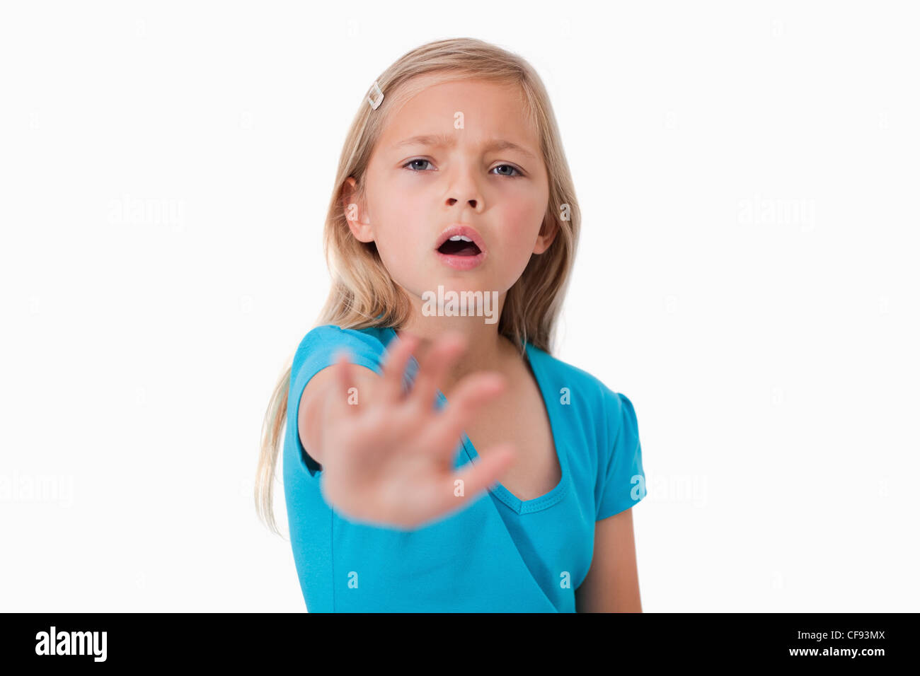 Unhappy girl saying stop with her hand Stock Photo - Alamy