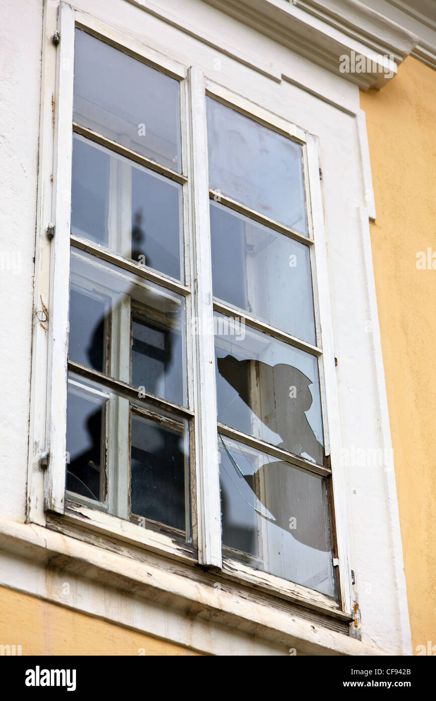 a window with a broken window pane. broken glass Stock Photo - Alamy