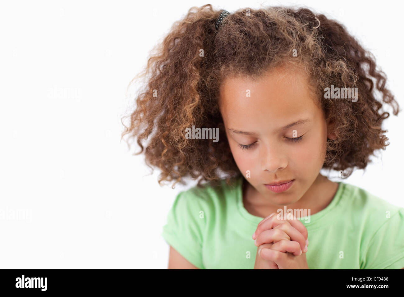 Cute girl praying Stock Photo - Alamy