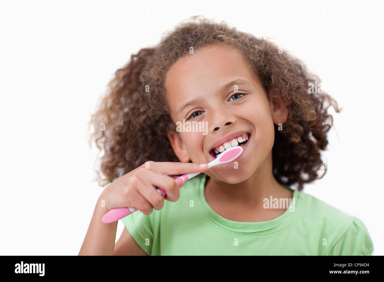 Cute girl brushing her teeth Stock Photo - Alamy