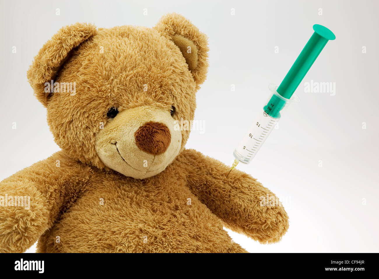s teddy bear getting an injection. immunizations and syringe Stock ...