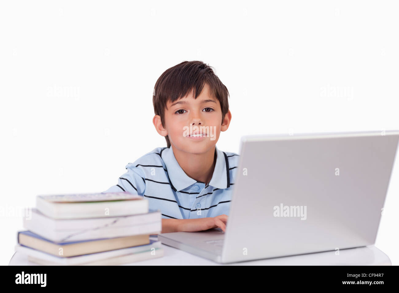 Boy working with a notebook Stock Photo - Alamy
