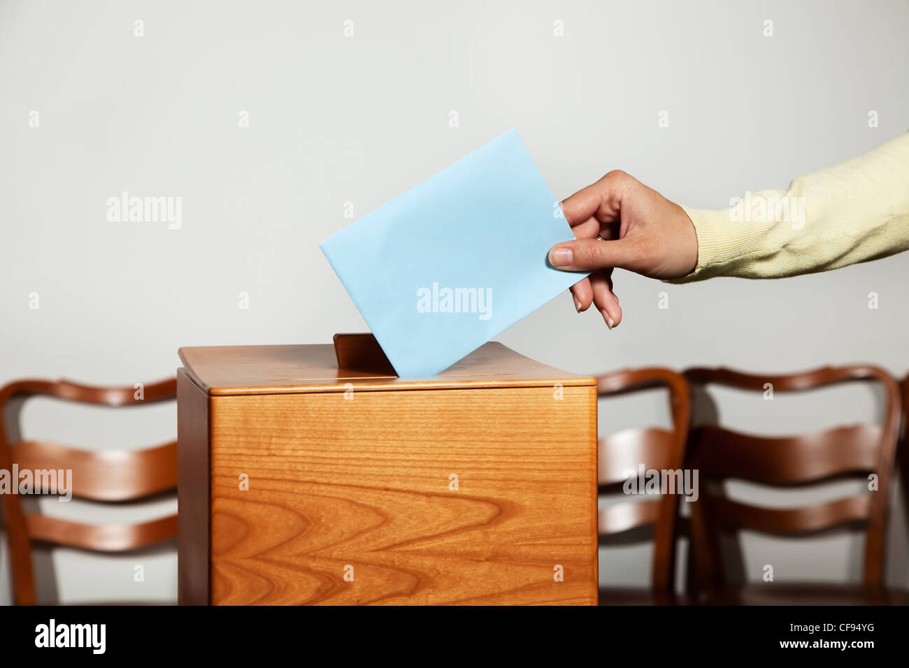a young woman in an election in the polling booth. voting in a ...