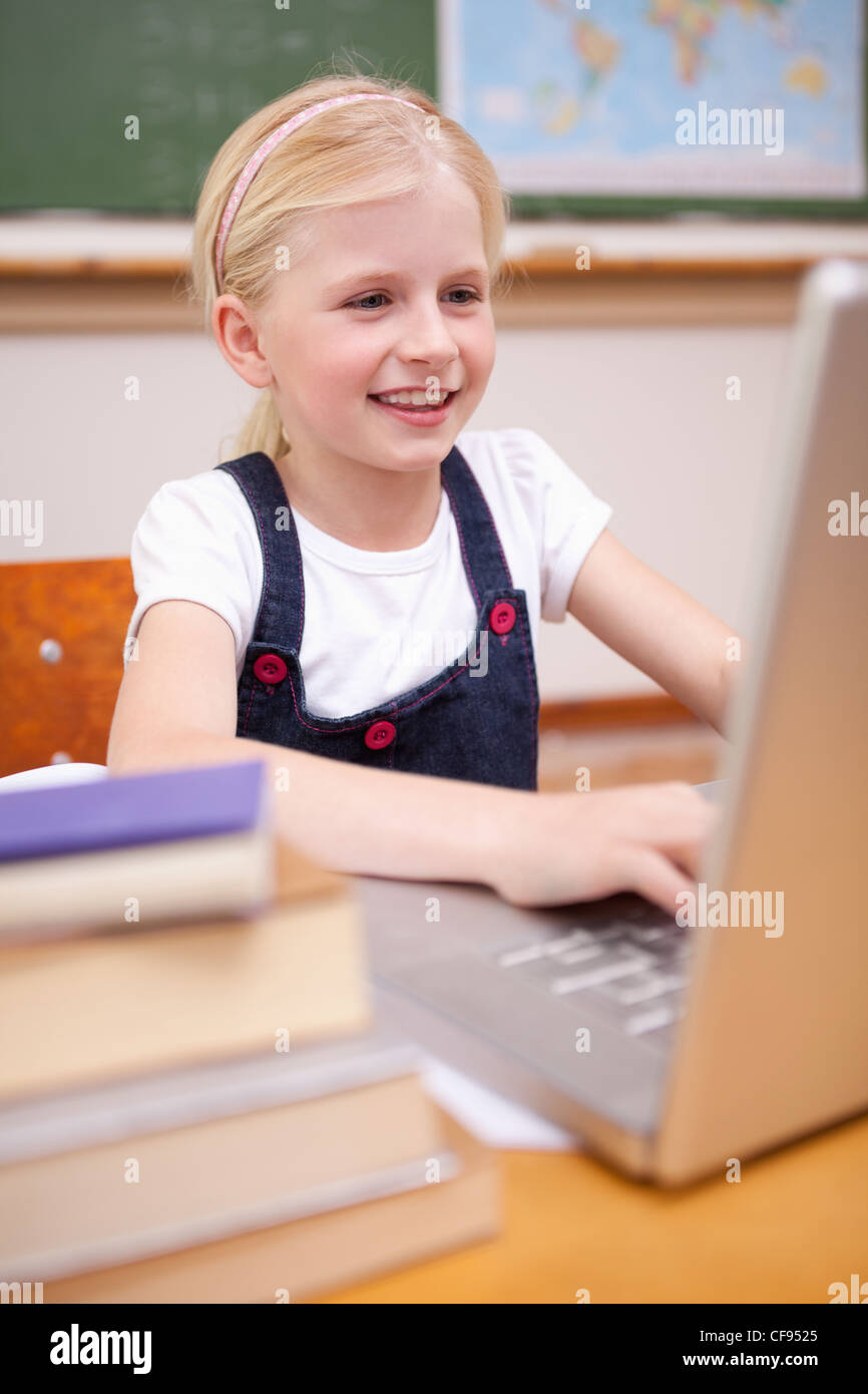Portrait of a girl using a laptop Stock Photo - Alamy