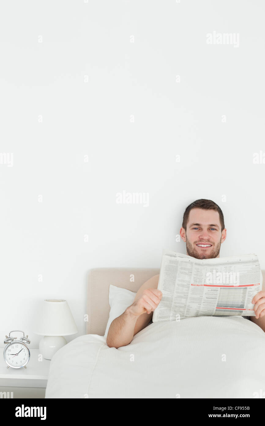 Portrait of a man reading a newspaper Stock Photo - Alamy