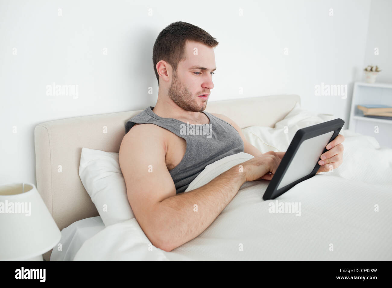 Man using a tablet computer Stock Photo - Alamy