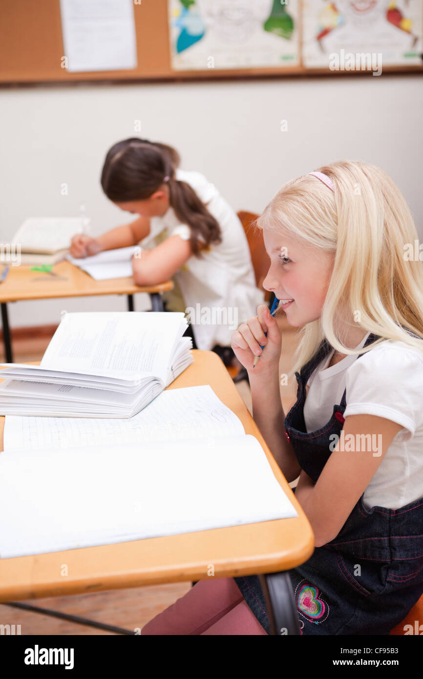 Portrait of pupils doing classwork Stock Photo - Alamy