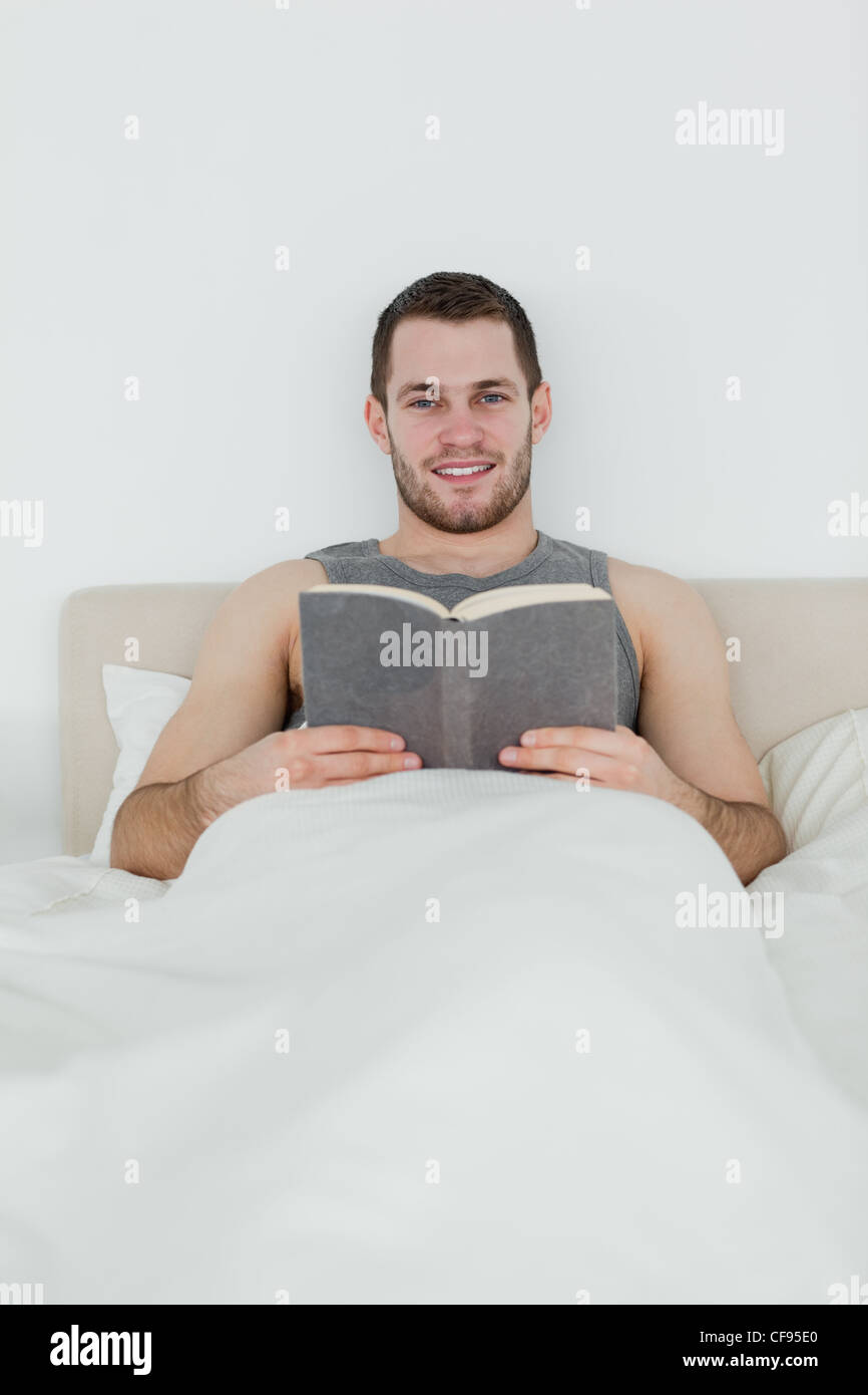 Portrait of a man reading a book Stock Photo - Alamy