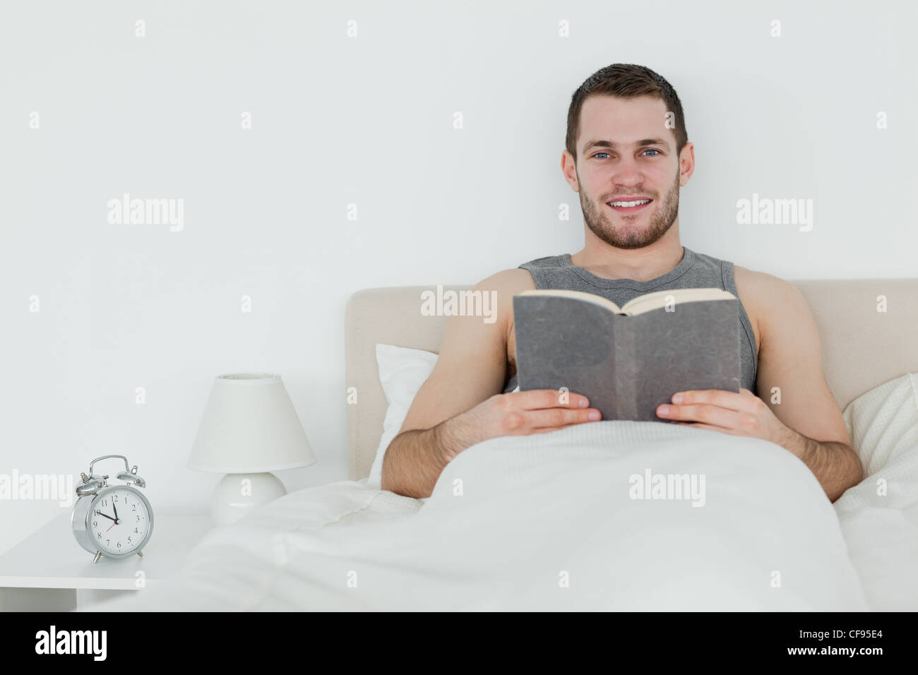 Man reading a book Stock Photo - Alamy