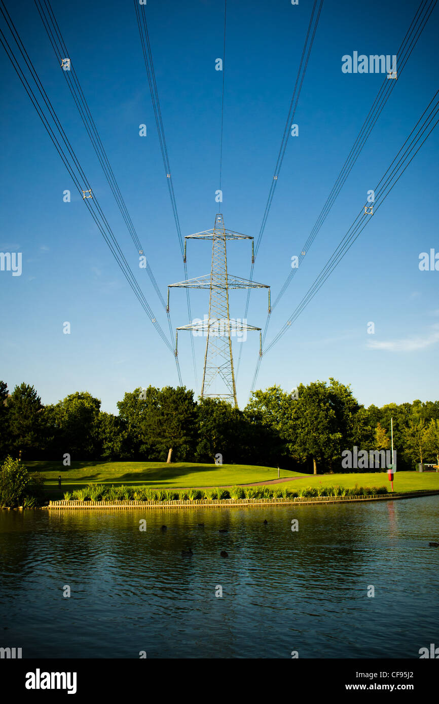 Picture of a pylon going over a small lake Stock Photo - Alamy