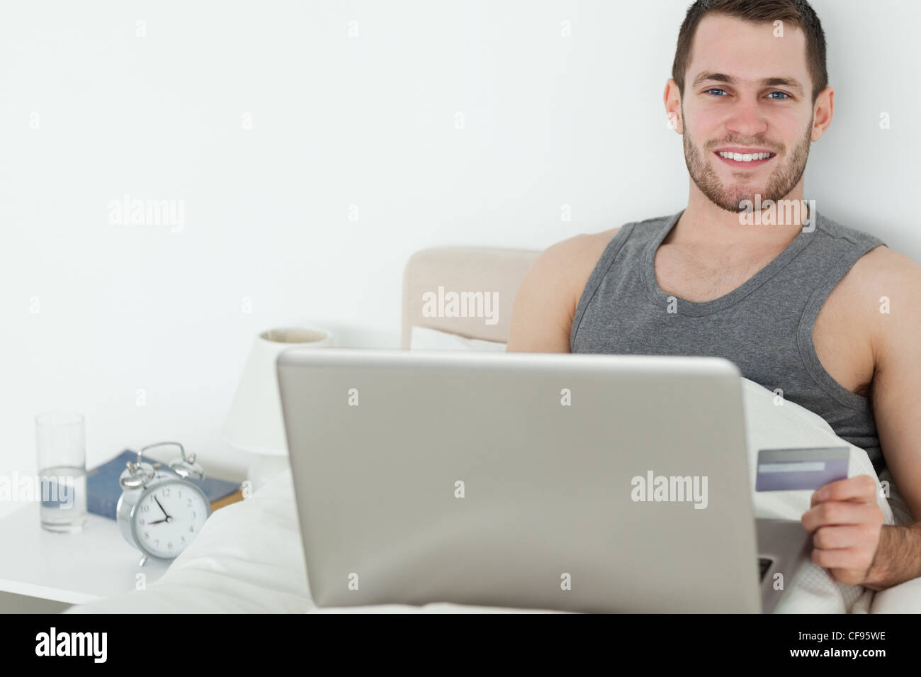 Handsome man shopping online Stock Photo - Alamy