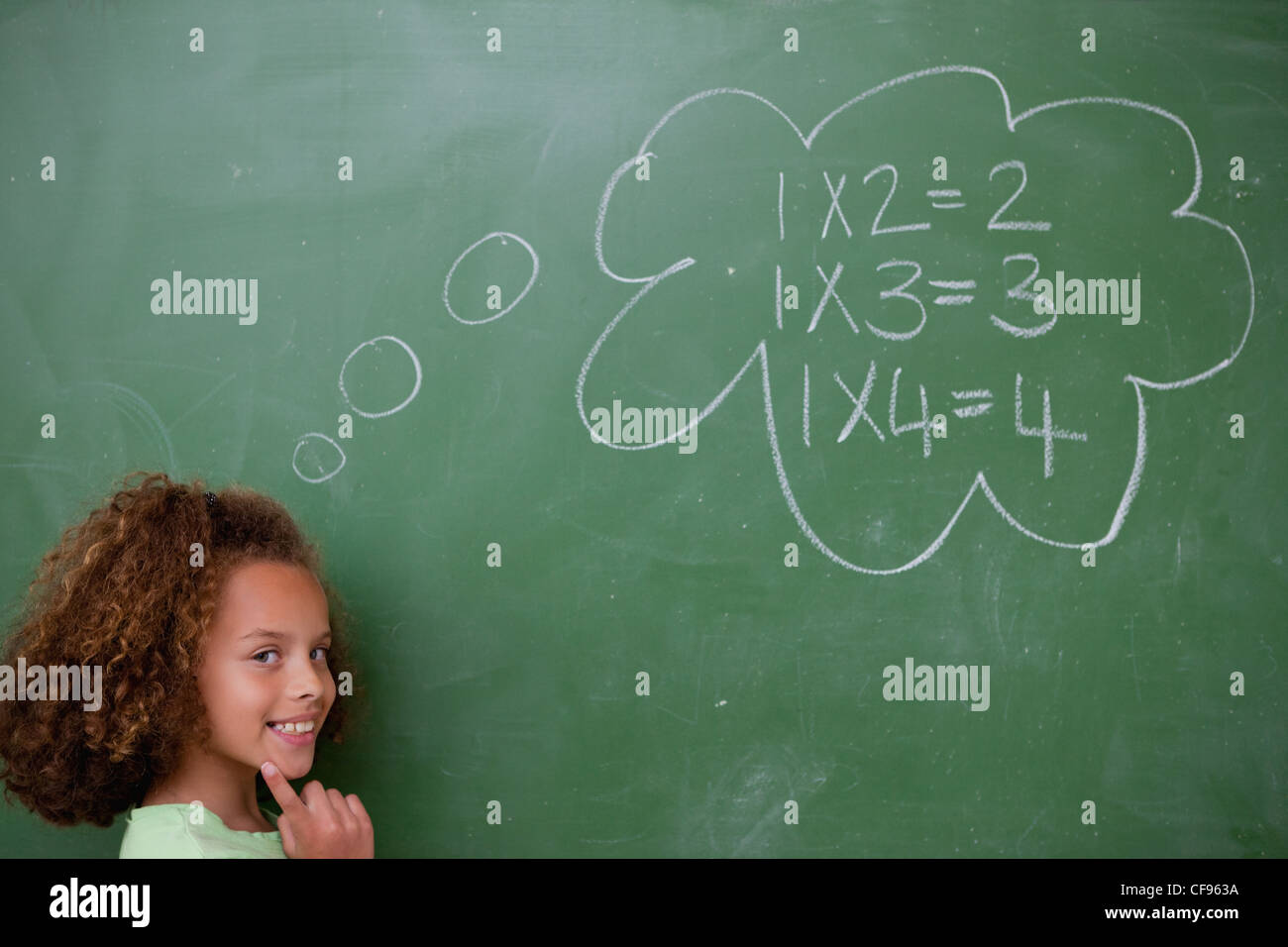 Schoolgirl thinking about mathematics Stock Photo - Alamy