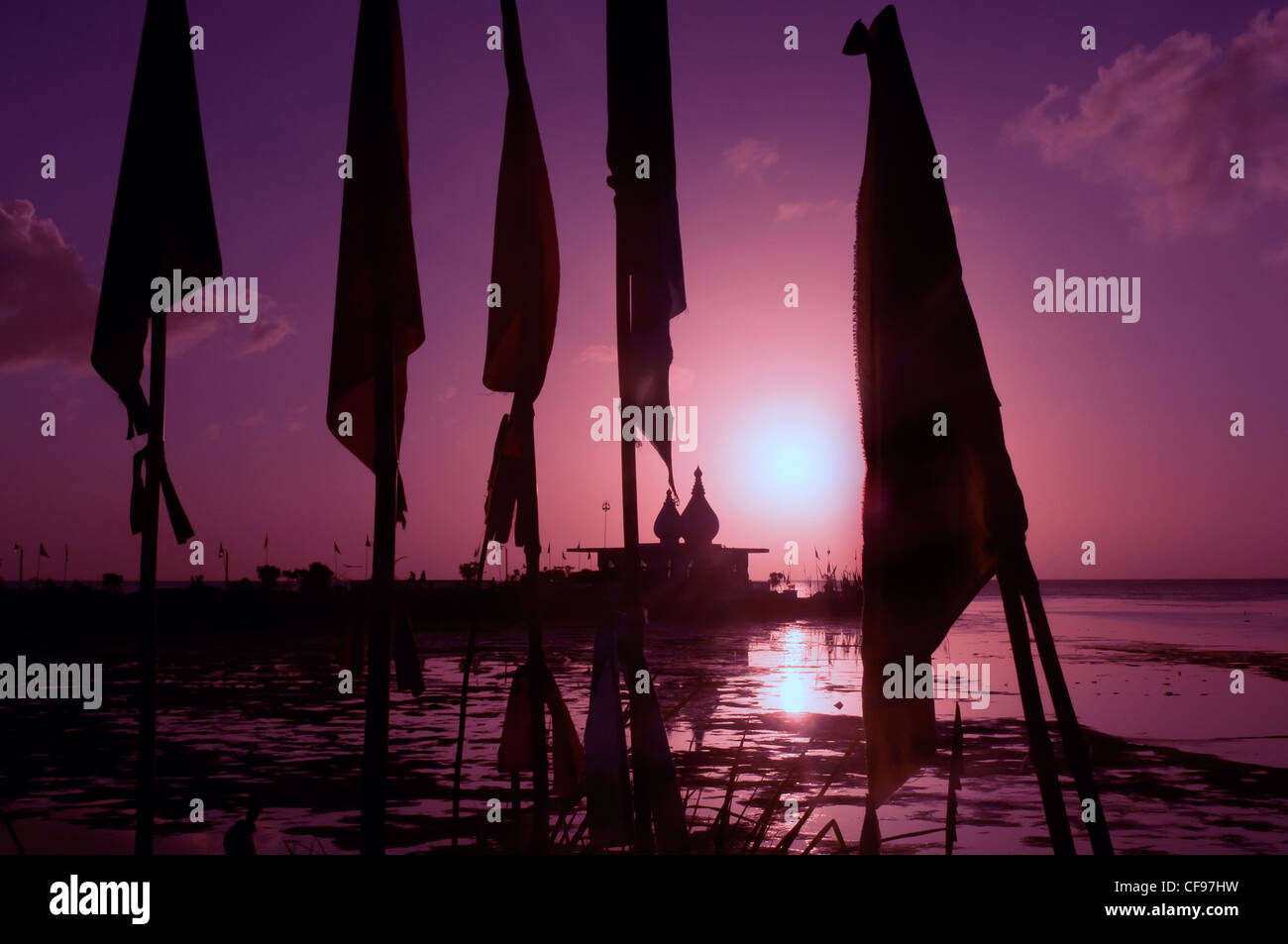 Symbolic religious flags along the shore next to a temple Stock Photo ...