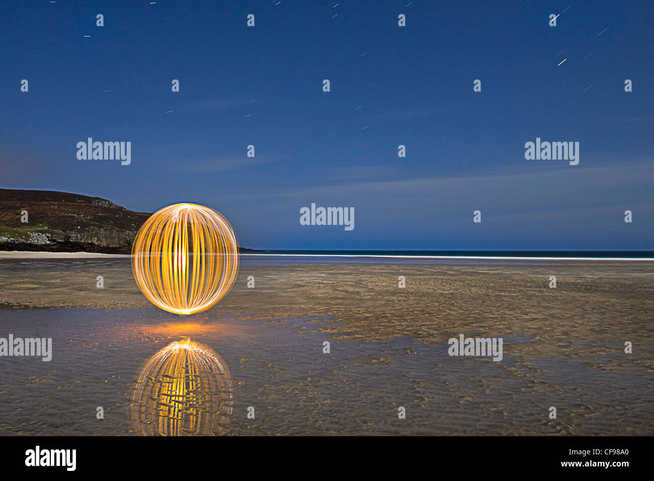 Orb on the beach. A lightpainted orb on the beach, created by long ...