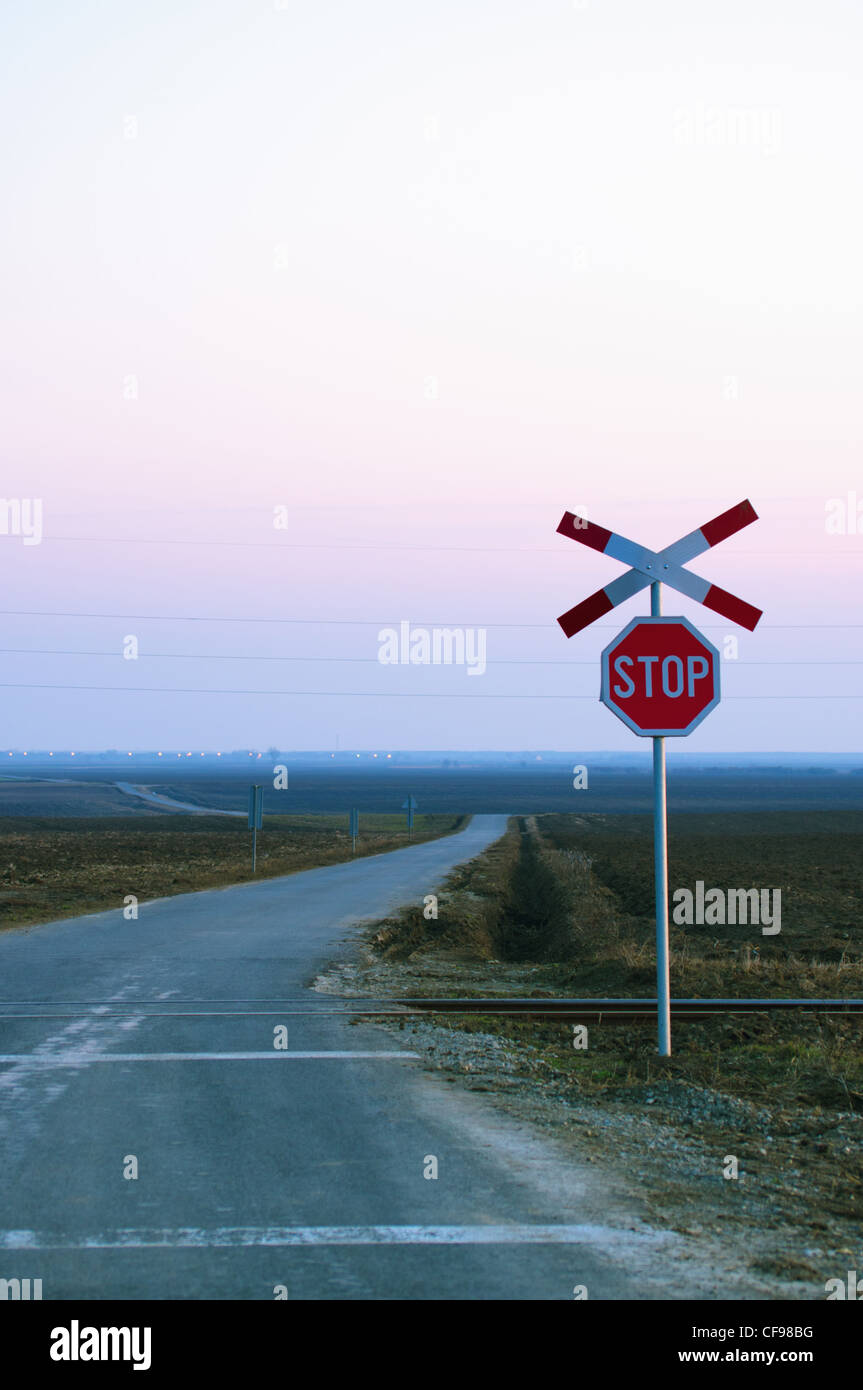 Railway cross and stop sign in middle of nowhere Stock Photo - Alamy