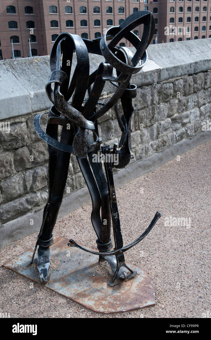 There is a modern artwork, a statue of a crossbowman, a solider with a ...