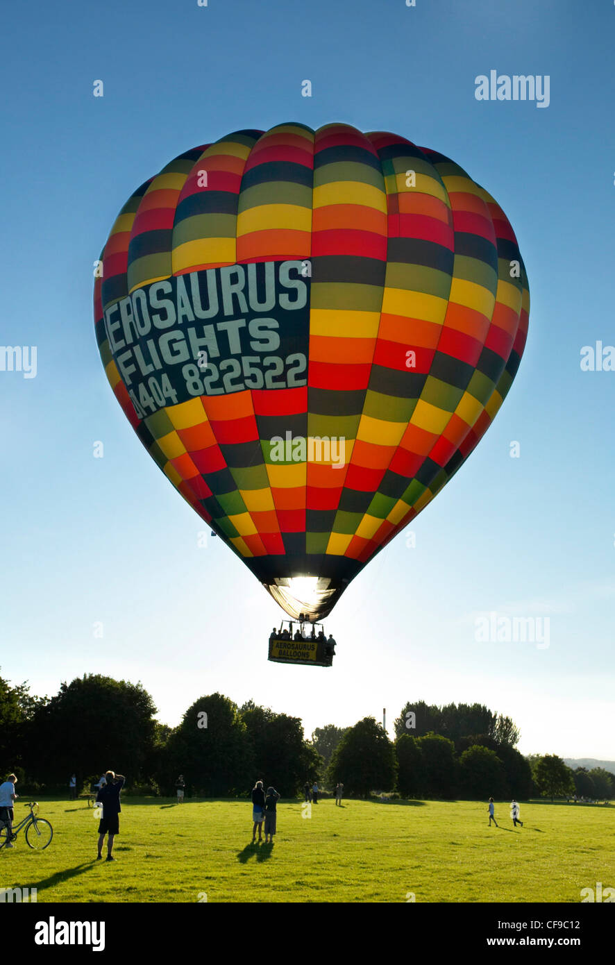 People watching a hot air balloon taking off, England, UK Stock Photo ...