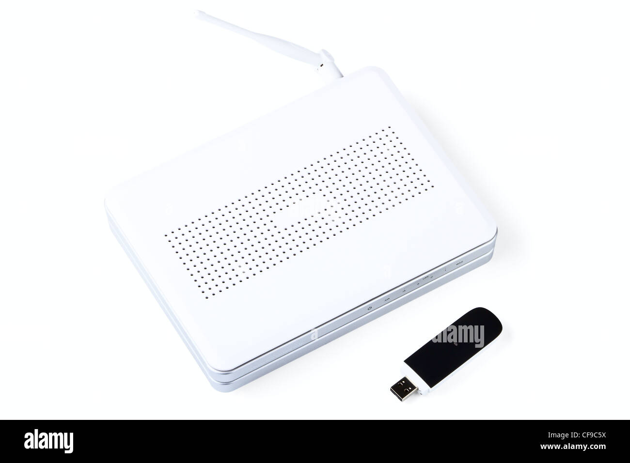 White wireless router and usb modem isolated on a white background ...