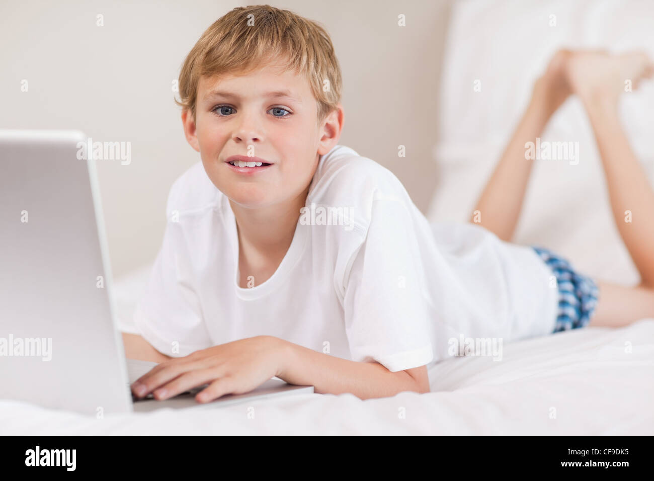 Boy using a laptop Stock Photo - Alamy