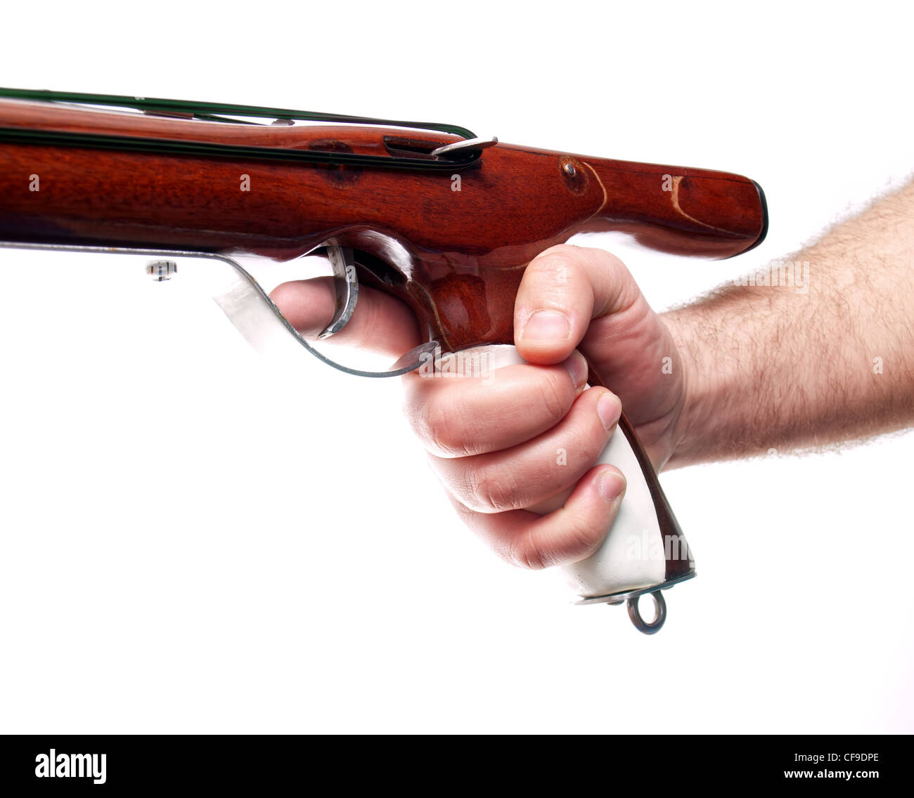 Finger on the speargun trigger on a white background Stock Photo - Alamy