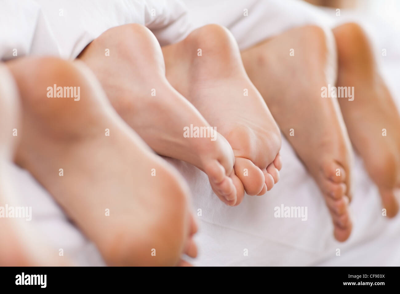 Family sleeping together feet father hi-res stock photography and ...