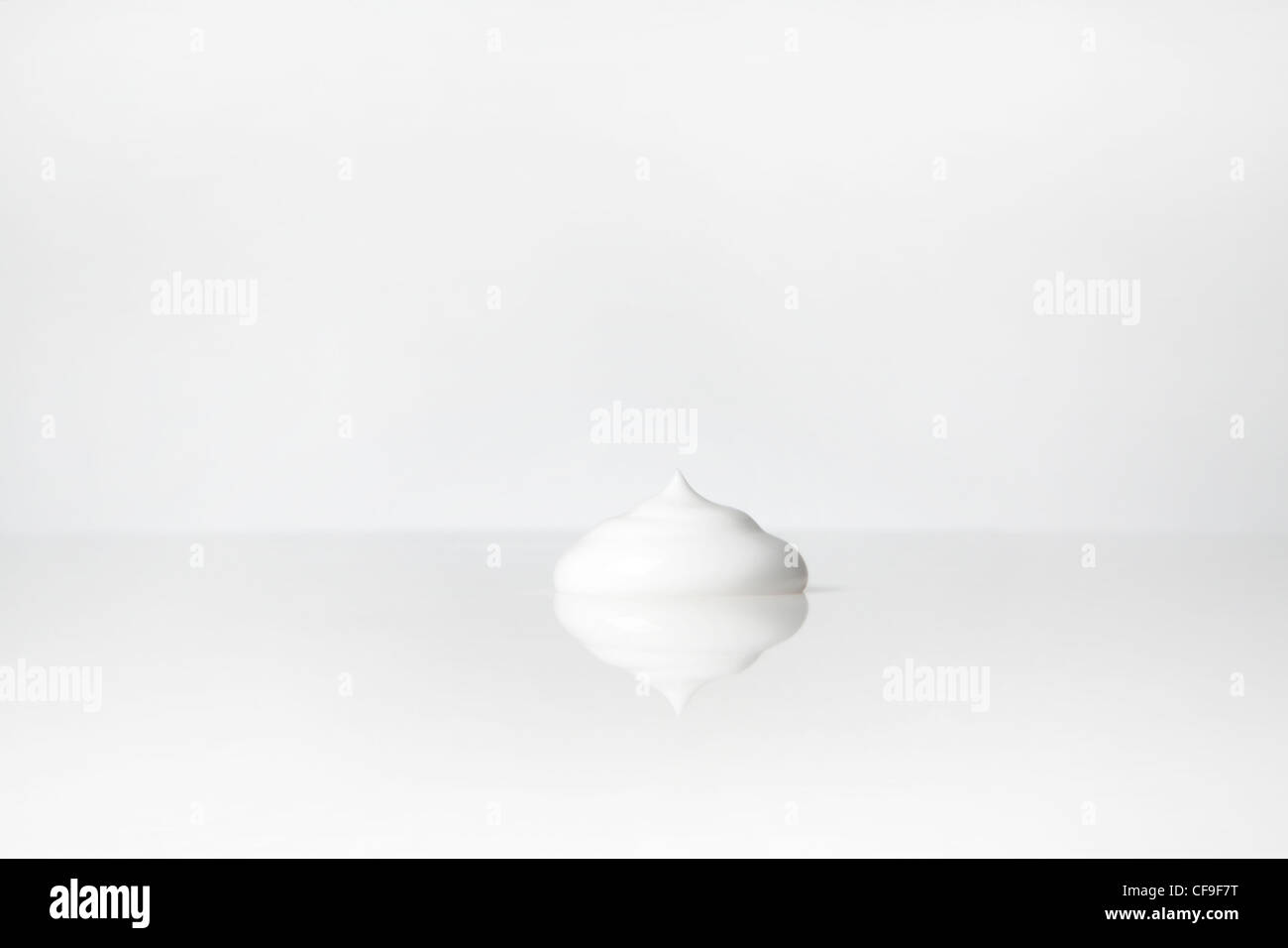 small drop of hand cream close up on a white background Stock Photo - Alamy