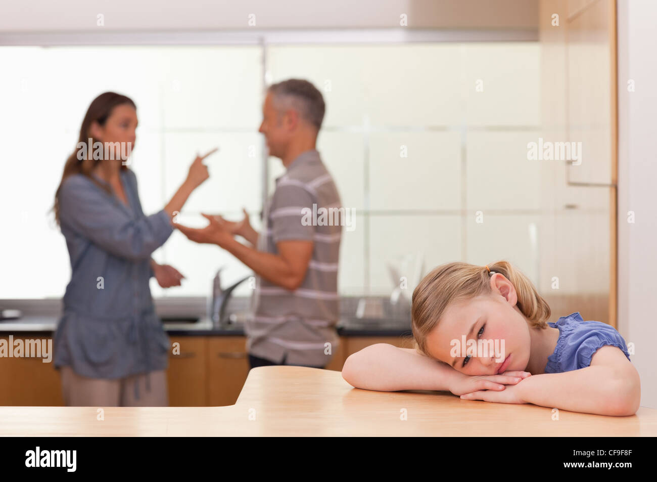 Sad little girl listening her parents having an argument Stock Photo ...