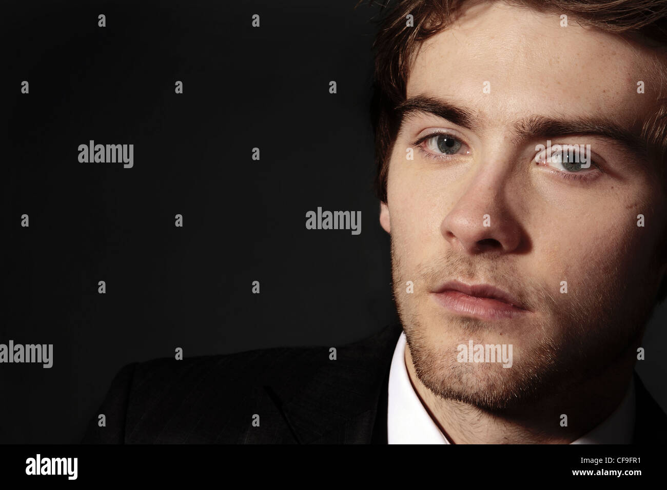 close up low key portrait of young man Stock Photo - Alamy