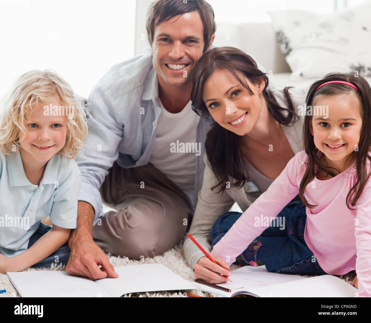 Smiling family drawing together Stock Photo - Alamy