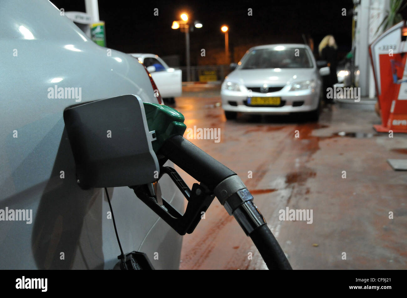 filling up unleaded petrol at a petrol station, photo by Shay Levy ...