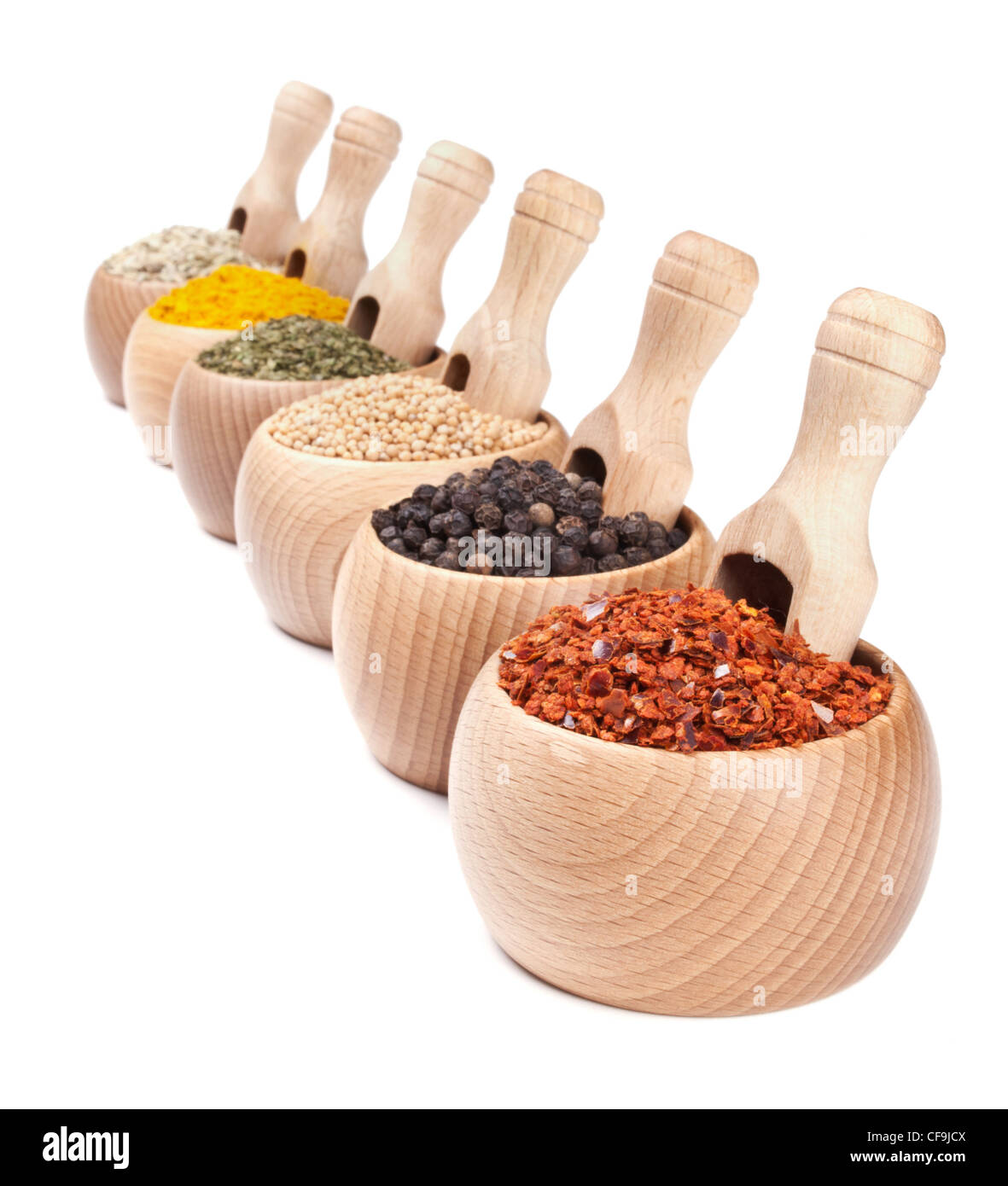 Row of wooden bowls with spices in them. Diminishing perspective Stock ...