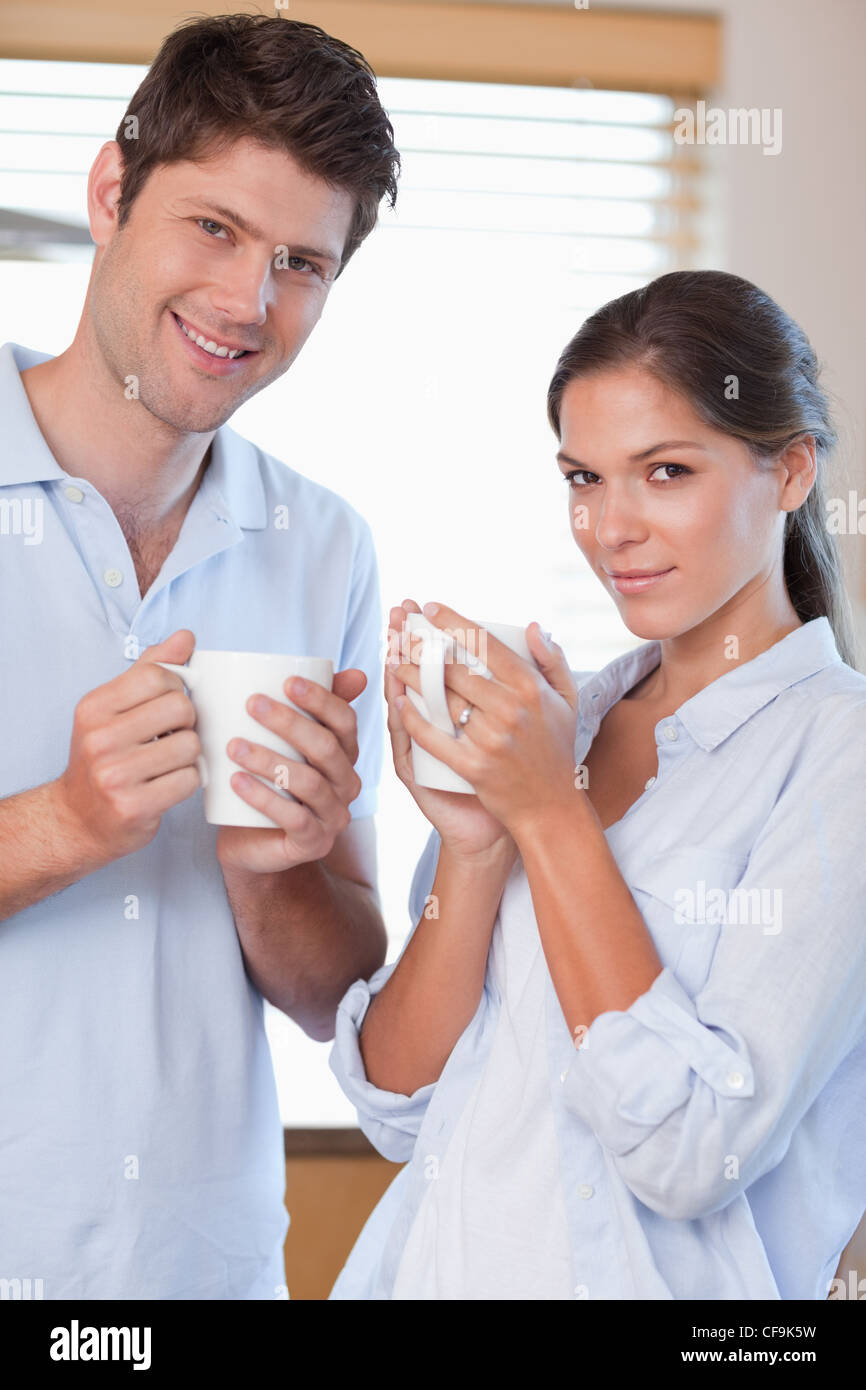 Portrait of a couple drinking tea Stock Photo - Alamy