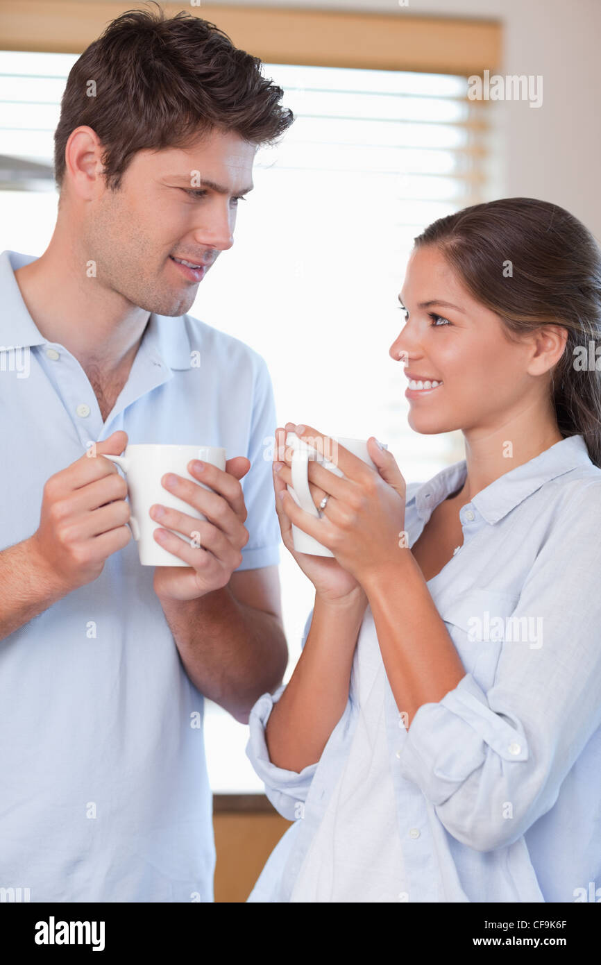 Portrait of a happy couple drinking coffee Stock Photo - Alamy