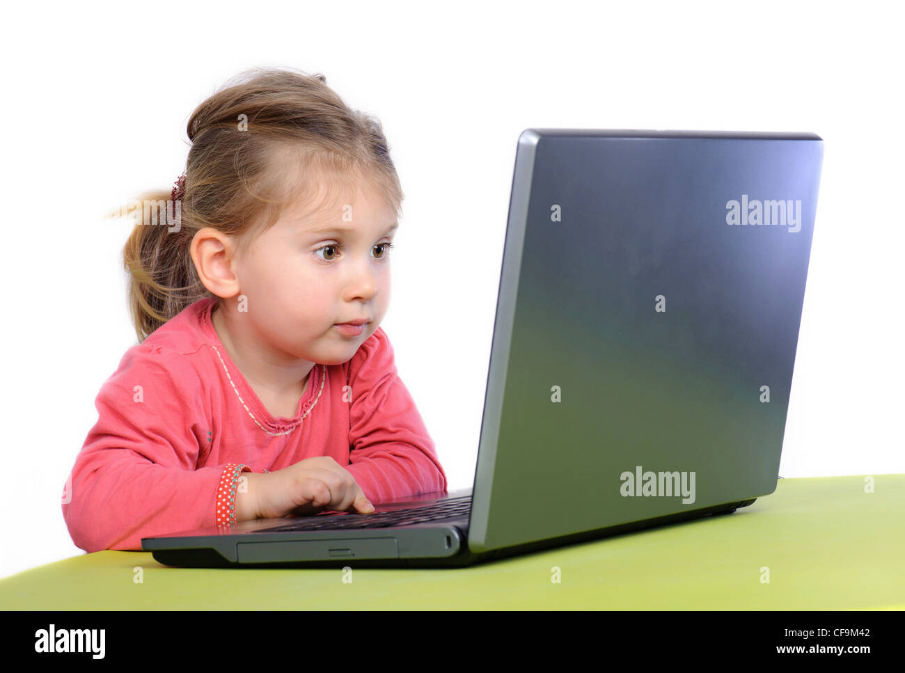 Little girl with laptop computer Stock Photo - Alamy