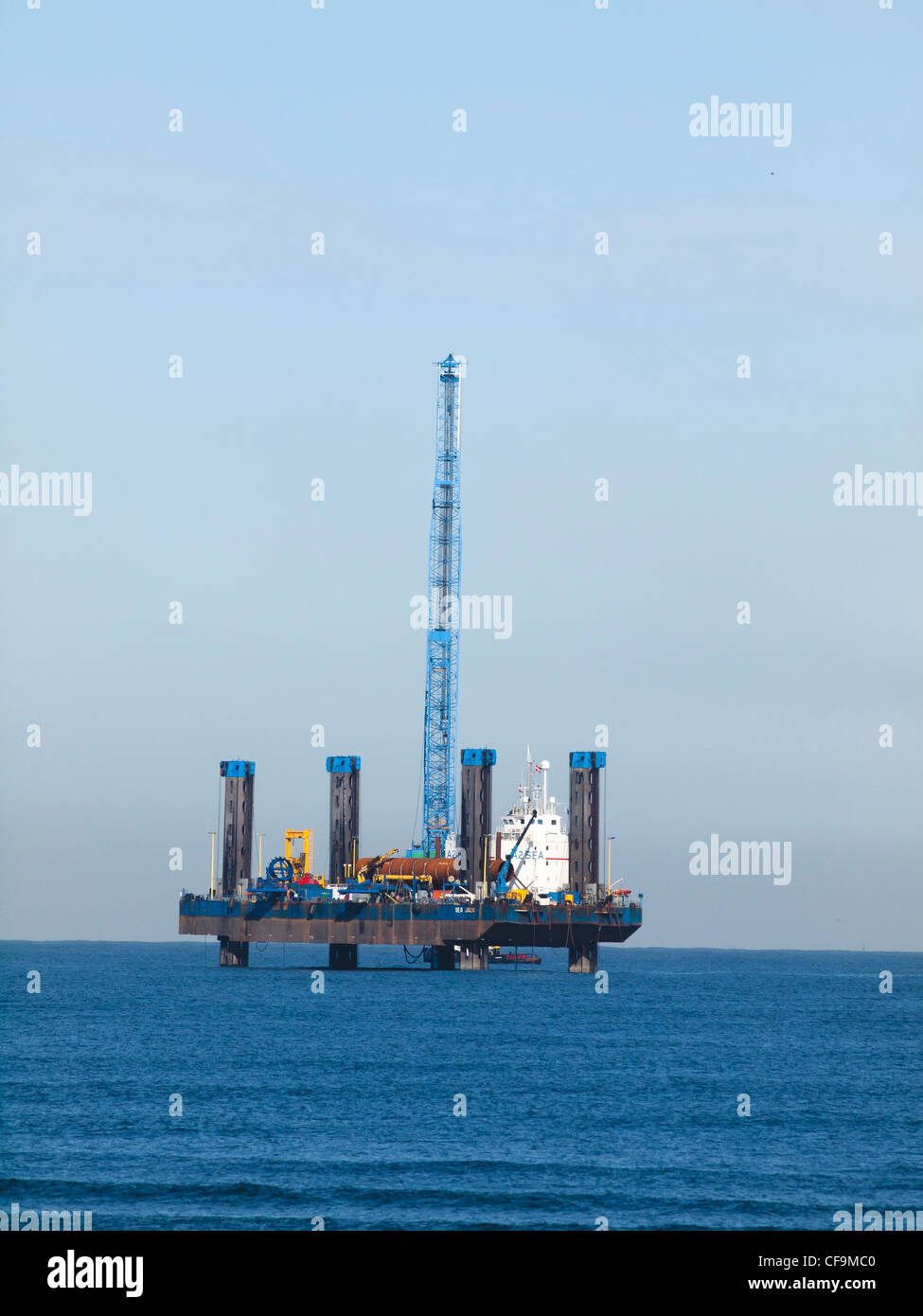Jack-up construction vessel SEA JACK installing monopile foundations ...