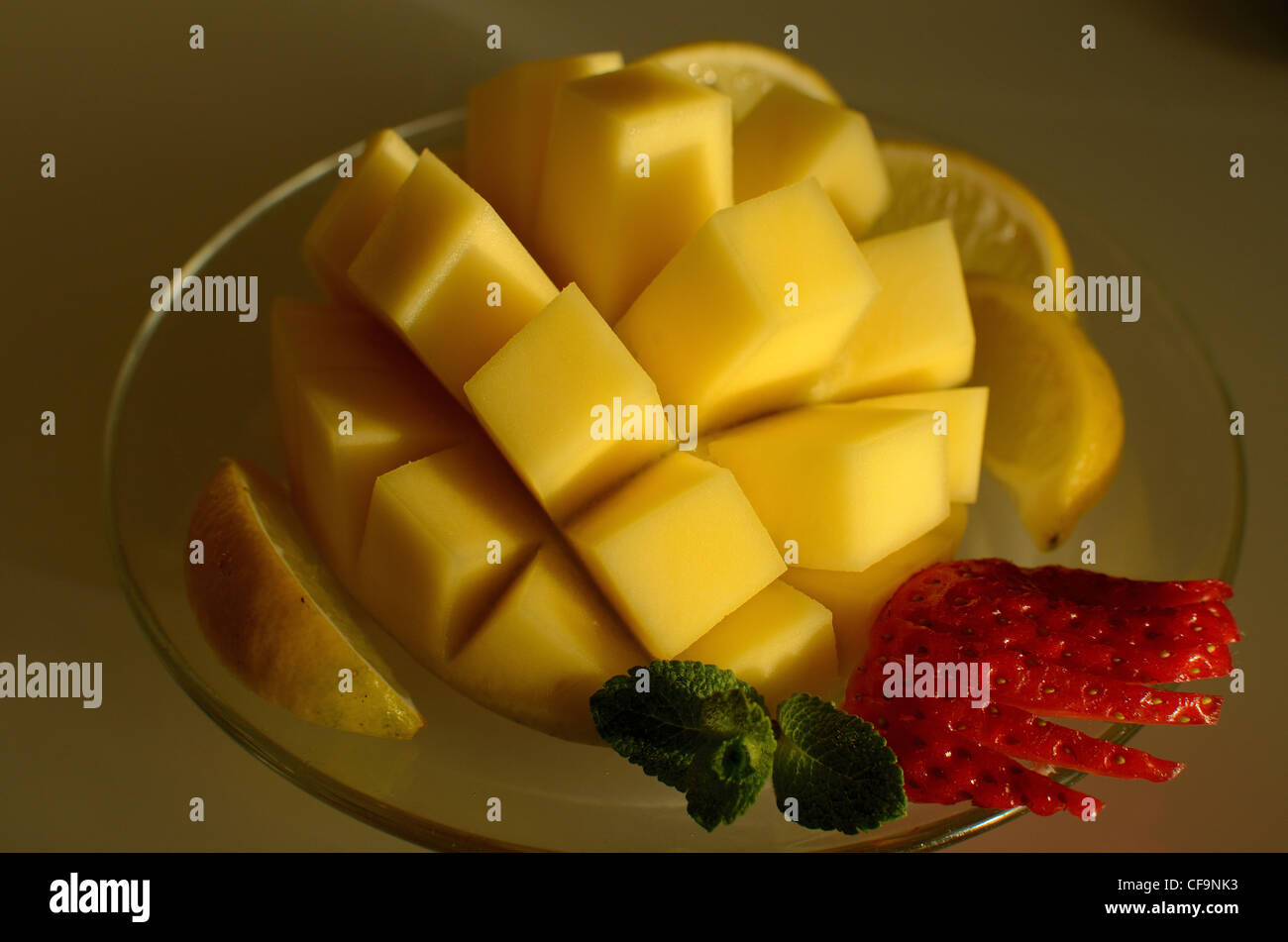 Mango with section on a white background Stock Photo - Alamy